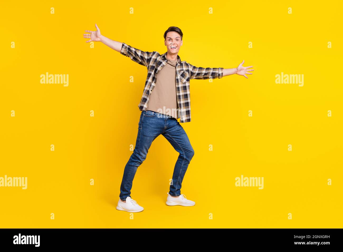 Photo of funny friendly positive guy invite embrace hug wear plaid ...