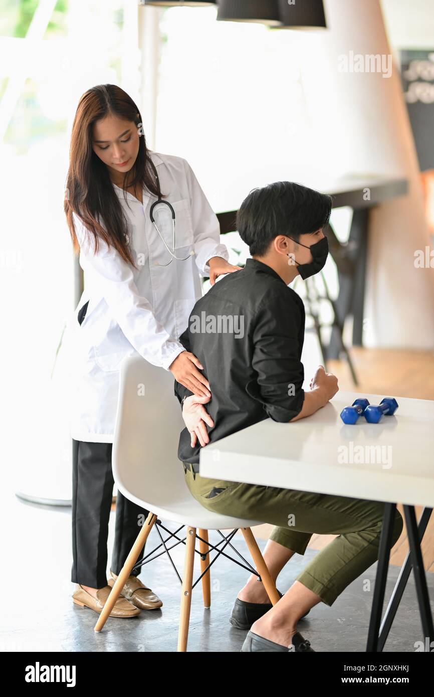 Female doctor examines male patient hi-res stock photography and images ...