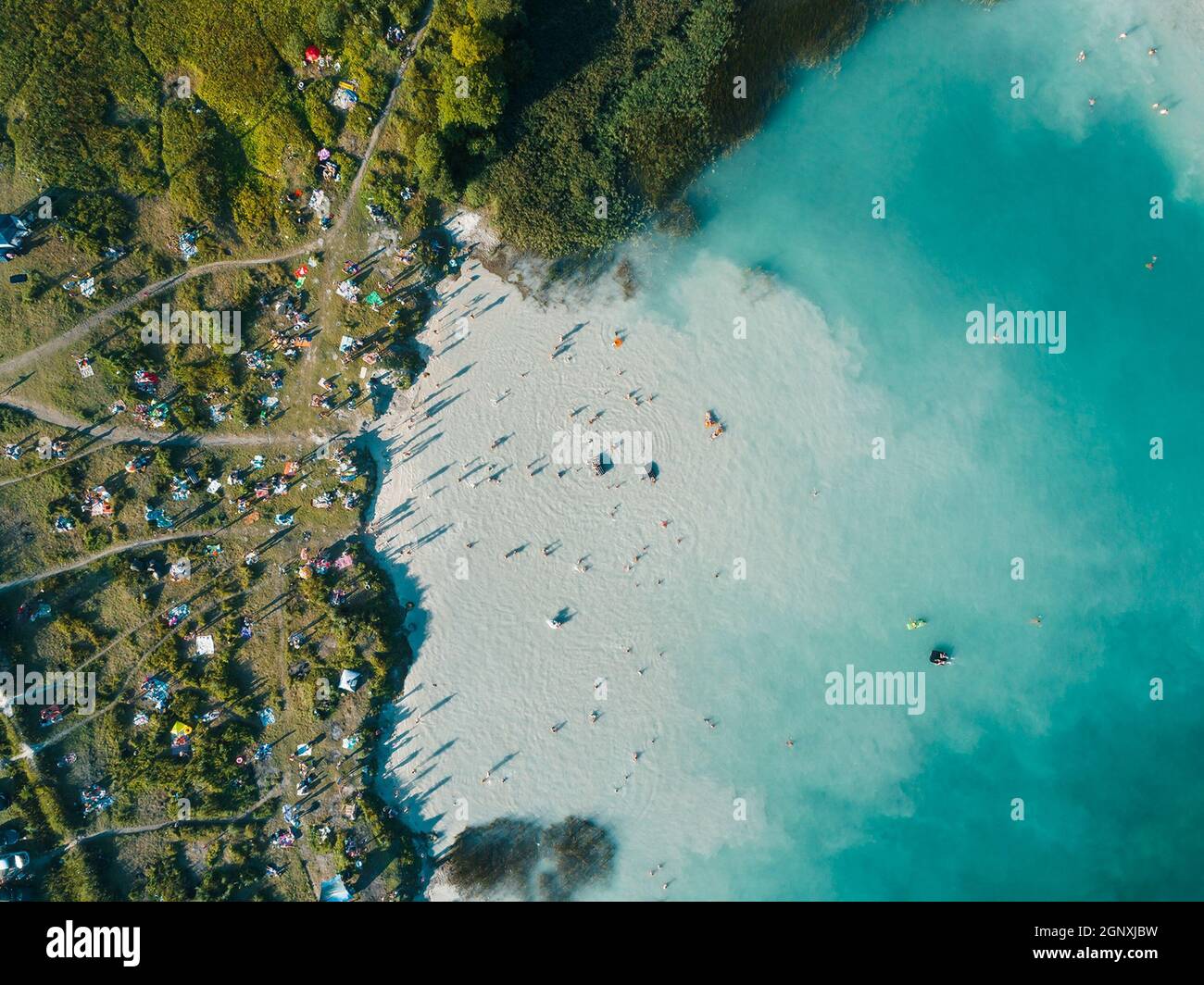 Beach on the shore with white sand and blue water, view from above ...