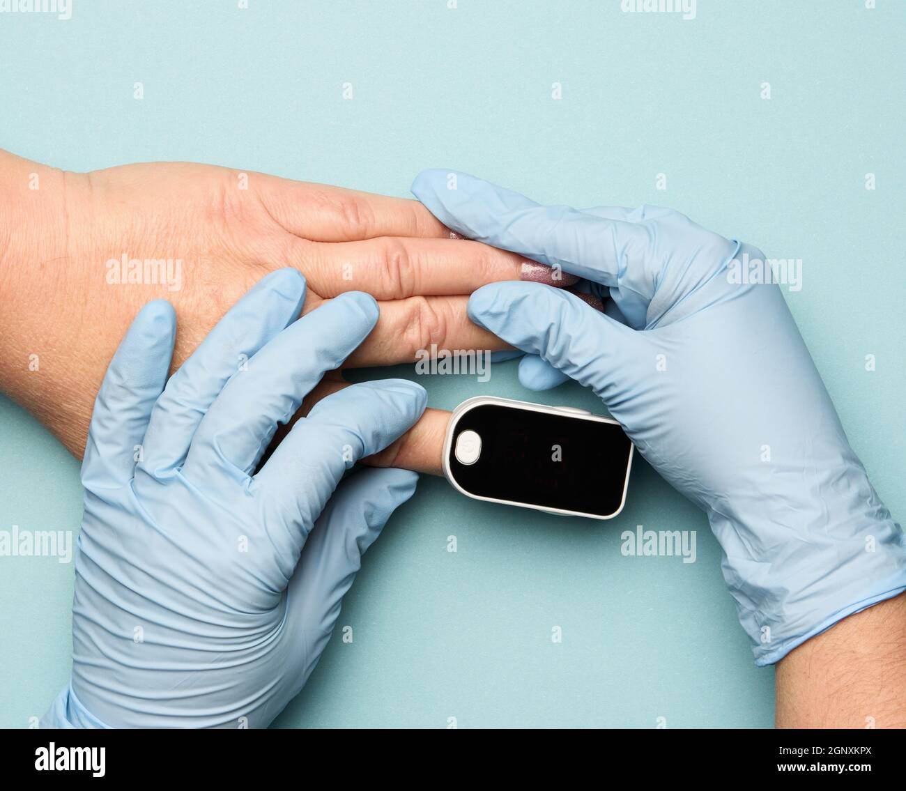 process of measuring the level of oxygen in the blood on a finger ...