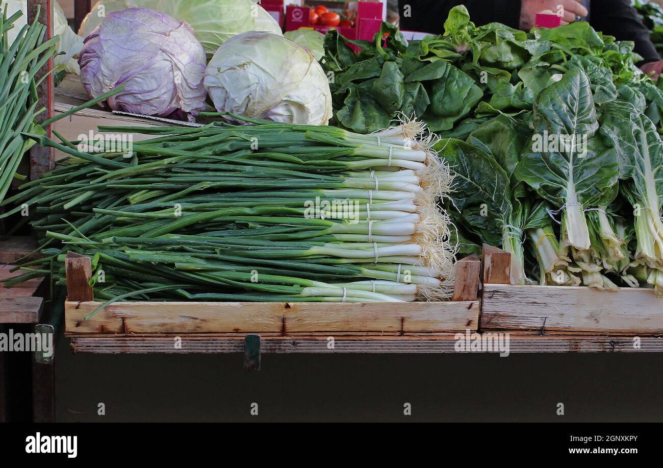 Market stall with piles of fresh organic green vegetables Stock Photo ...