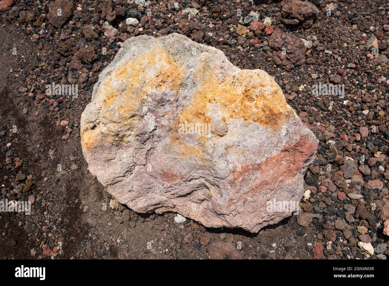 A piece of volcanic rock ejected from Mount Etna, coloured by sulphur ...
