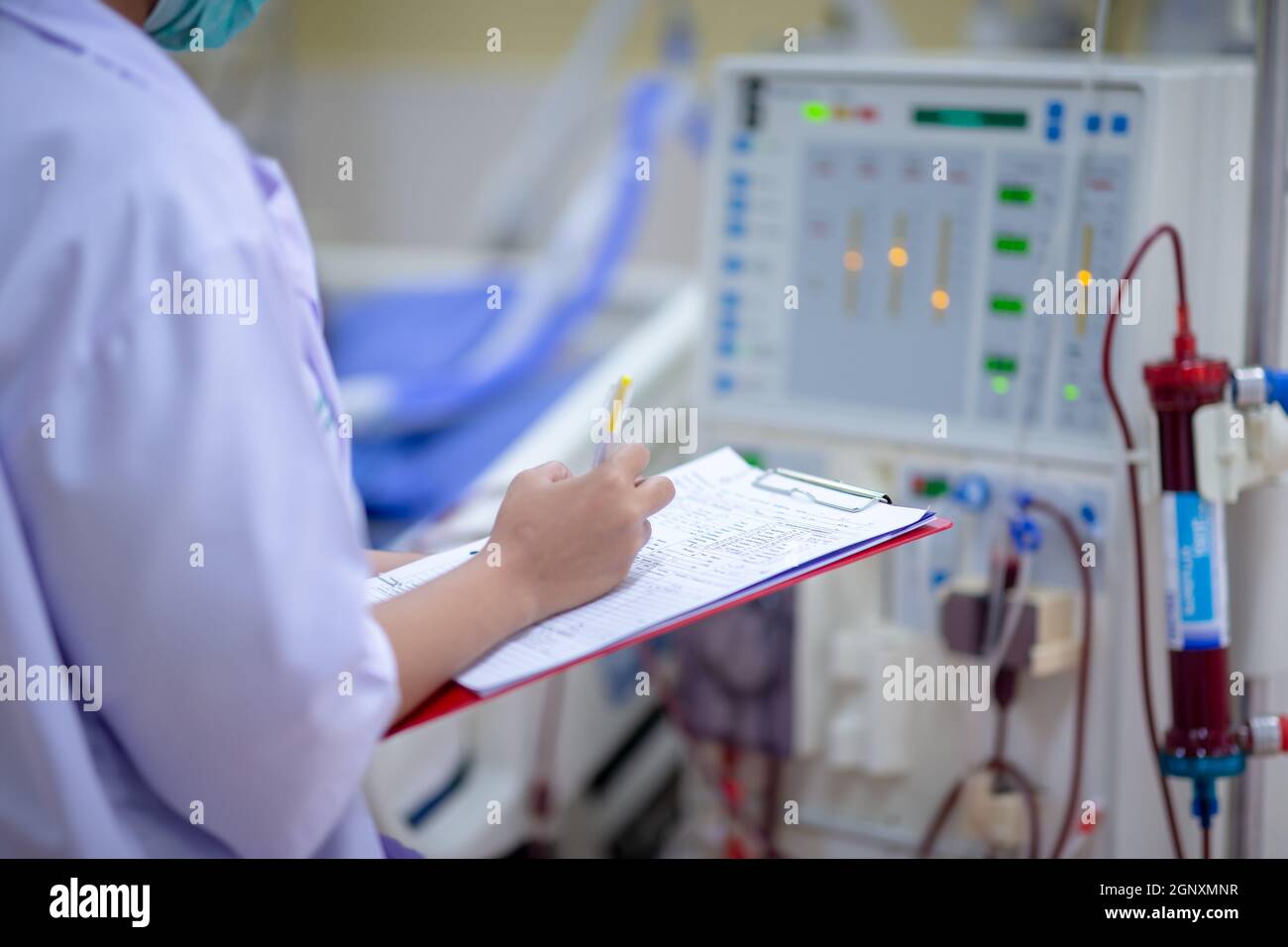 Dialysis nurse are checking dialysis machine before hemodialysis ...