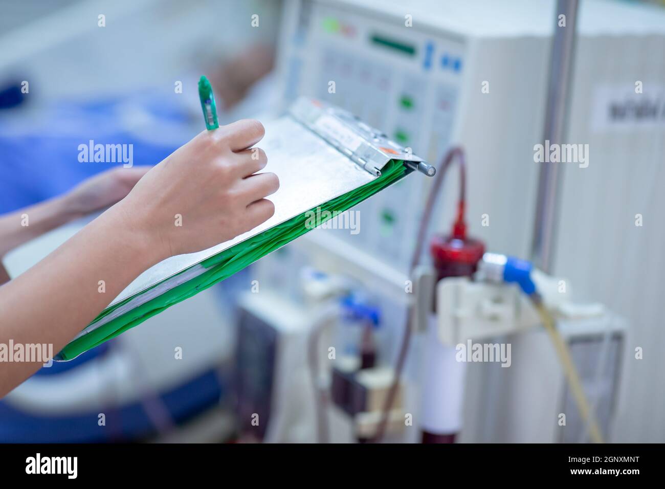 Dialysis nurse are checking dialysis machine before hemodialysis ...