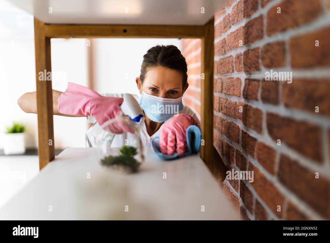 Living Room House Cleaning Service In Face Mask Stock Photo - Alamy