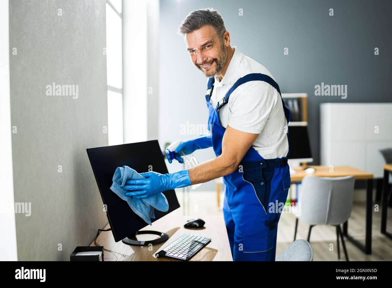 Professional Office Cleaning Janitor Service. Monitor At Desk Stock ...