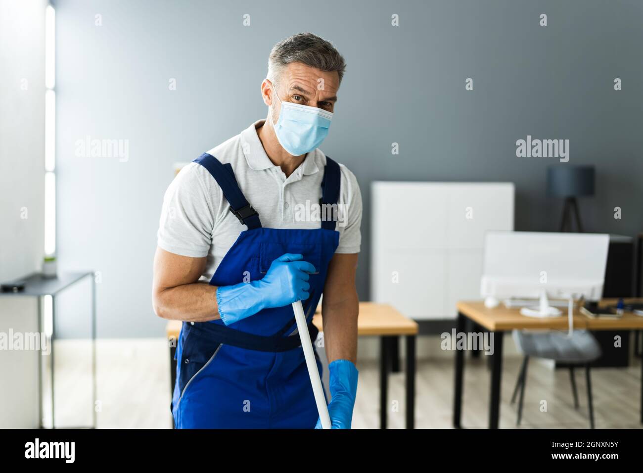 Male janitor in mask hi-res stock photography and images - Alamy