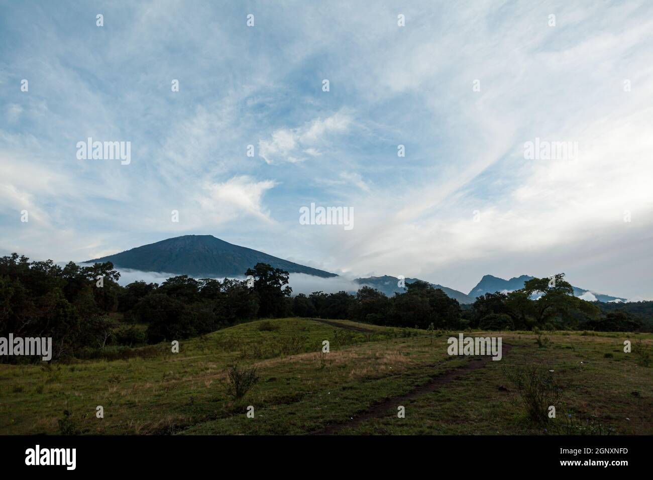 Beautiful landscape of mount Rinjani surrounded by clouds, Lombok ...