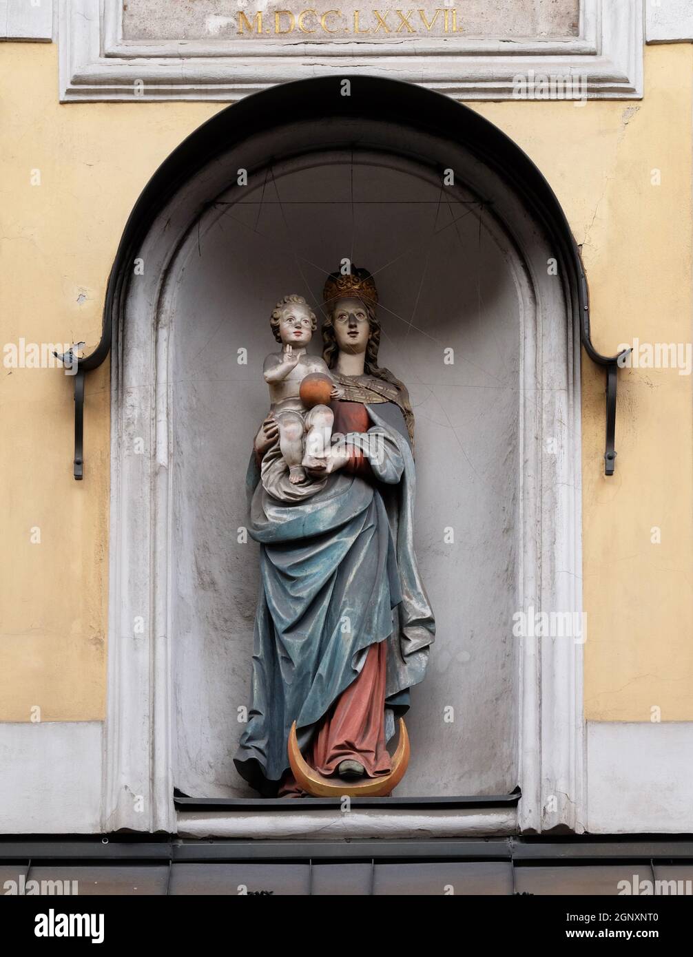 Virgin Mary with baby Jesus, statue on the house facade in Graz, Styria ...