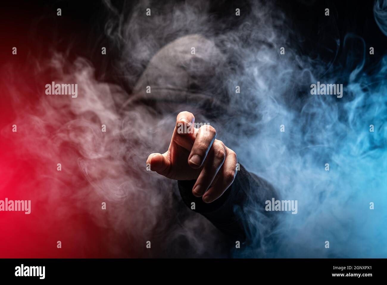 Hacker in a smoke-filled background, a hacker in a hood, dark face ...