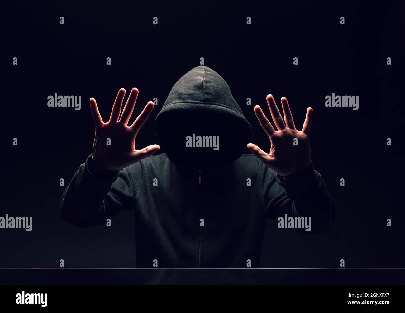 Dark face hacker. Hacker in hoodie dark theme Stock Photo - Alamy