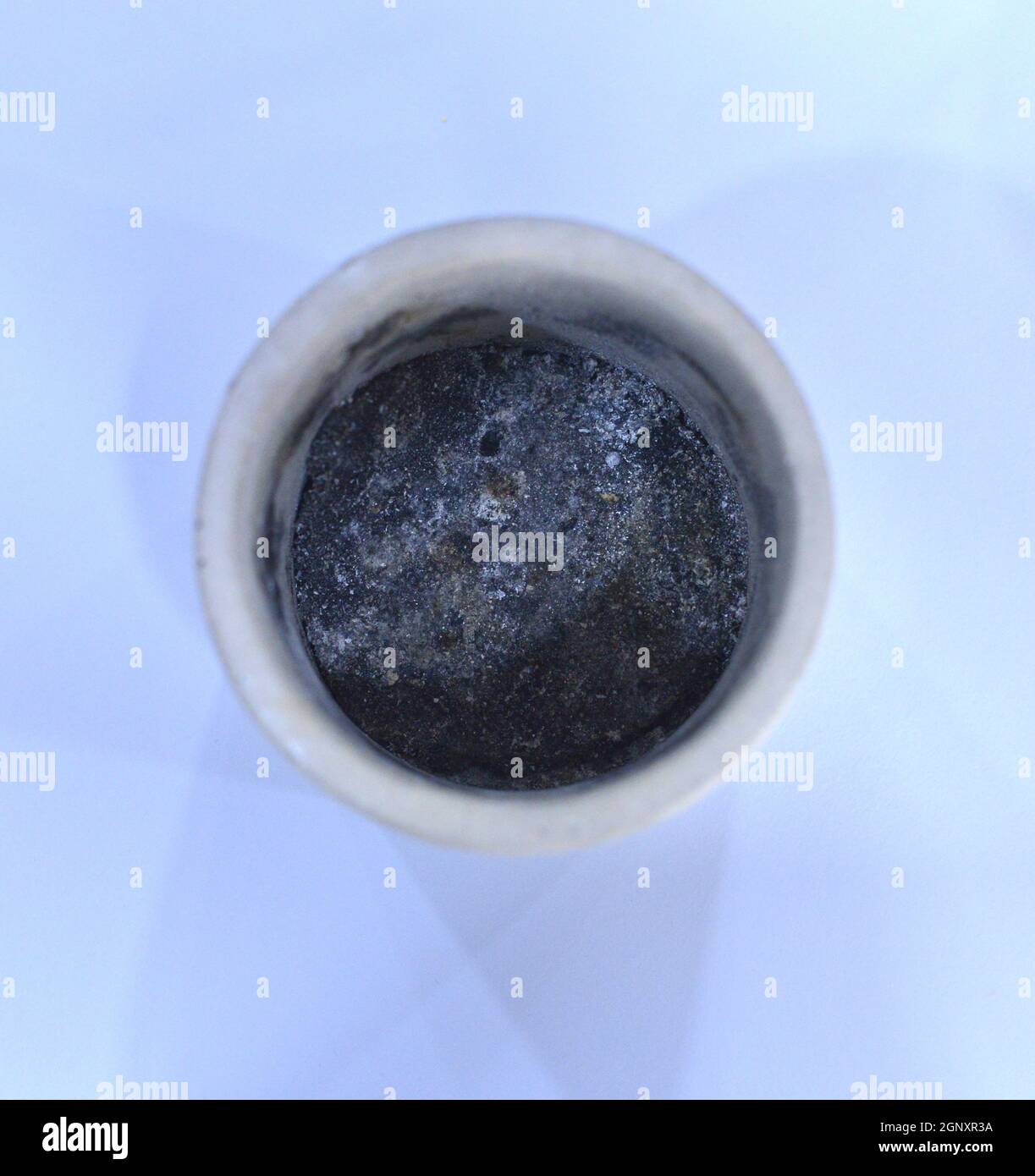 Closeup shot of an ashtray full with ash on the table Stock Photo - Alamy