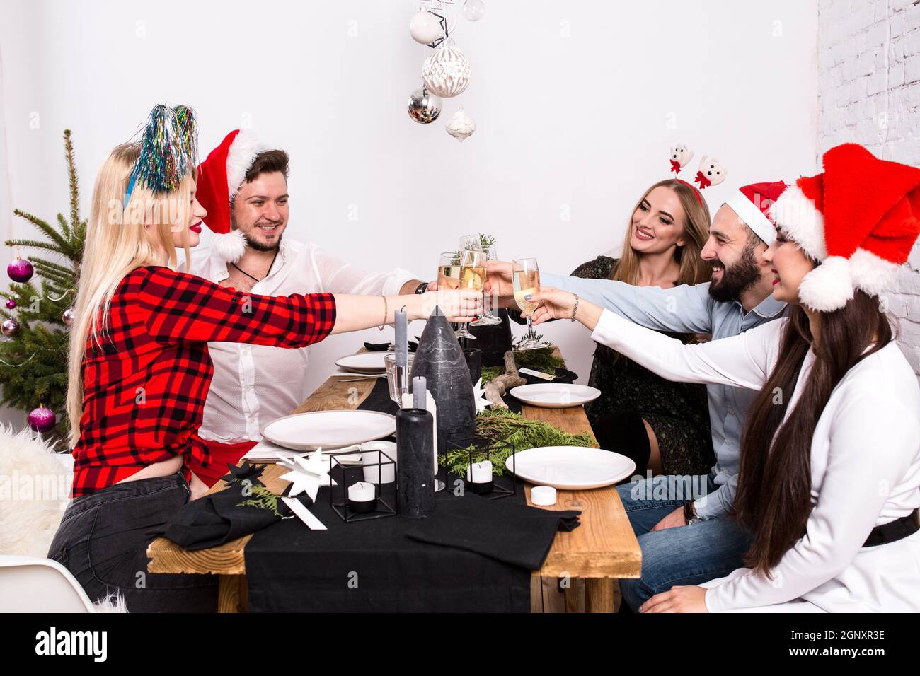 Christmas party cheerful friends at having drink and fun Stock Photo ...