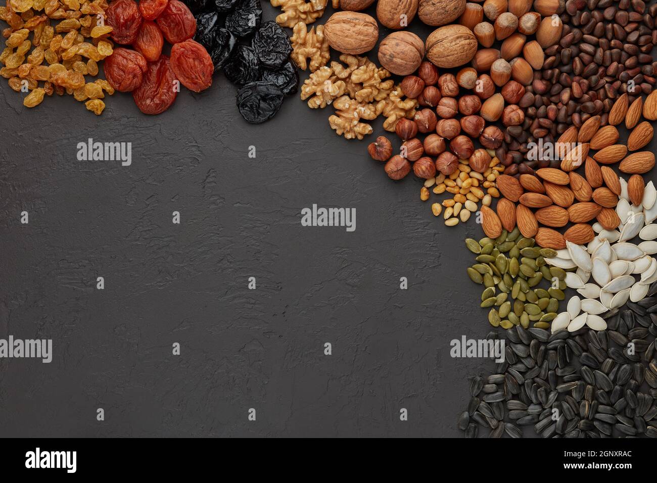 Different kinds nuts and dried fruits. Various varieties of nuts, seeds ...