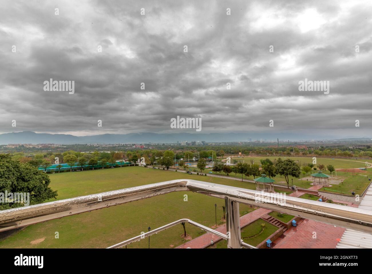 Aerial view of a park on the background of the cityscape of Islamabad ...