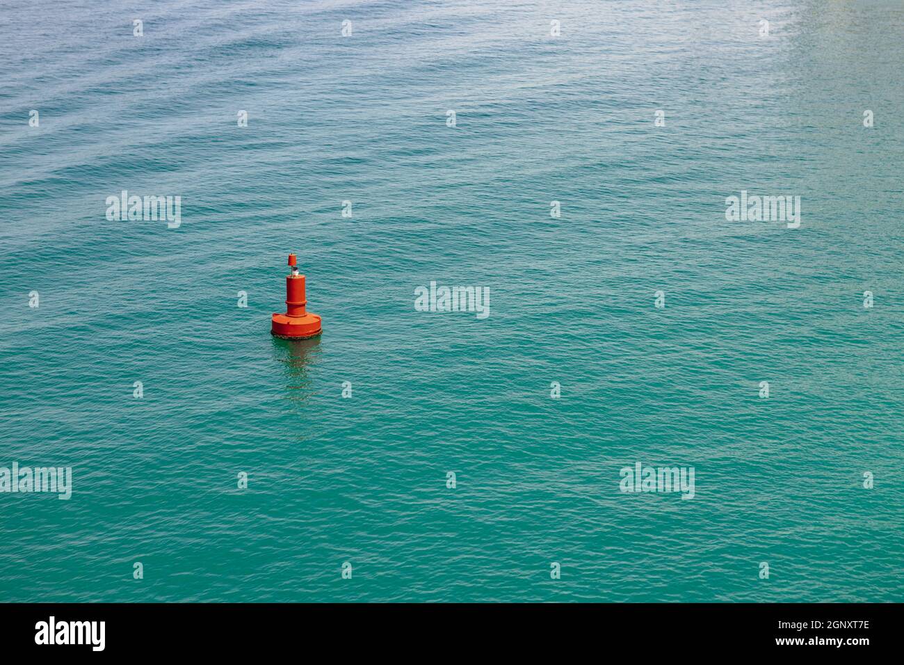 Single red buoy in the clear sea Stock Photo - Alamy