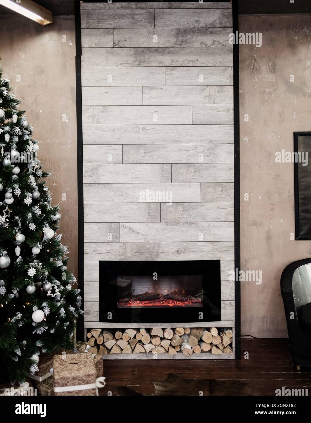 Christmas interior with fireplace. loft apartment Stock Photo - Alamy