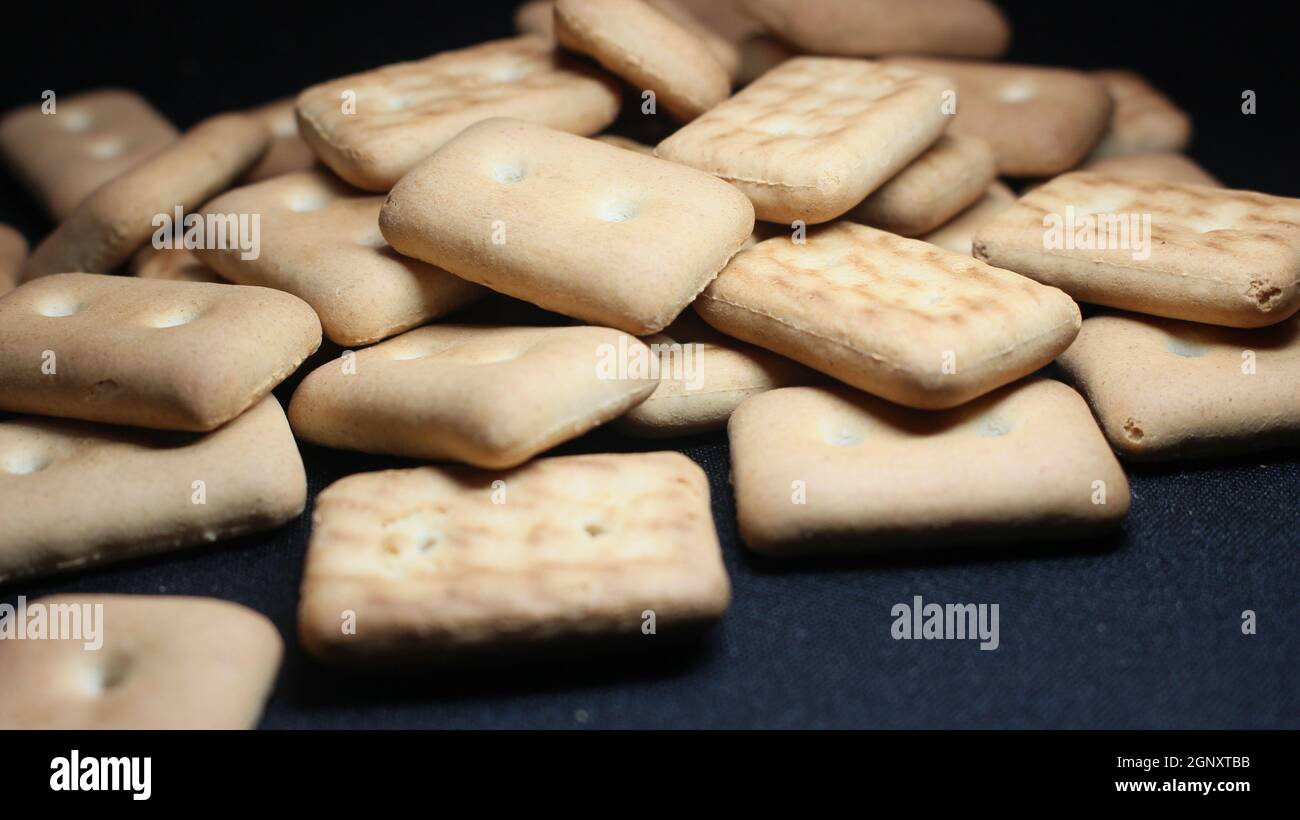 Close up top view of of biscuit cookies. Many rectangular biscuits with ...
