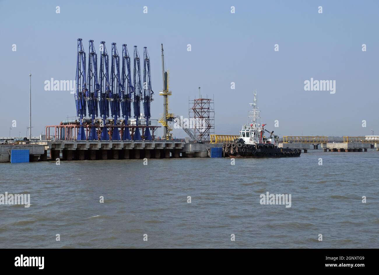Natural gas and crude oil pipeline. Floating fuel station located near ...