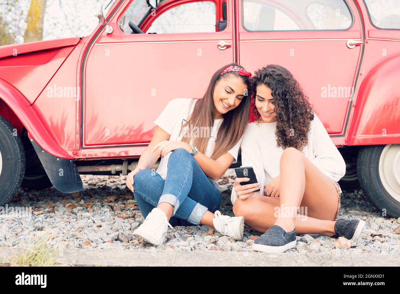 Two friends going on a roadtrip through countryside Stock Photo - Alamy