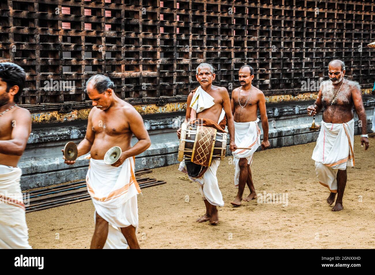 Locals in traditional dress enjoy a religious ceremony in Kerala, India ...