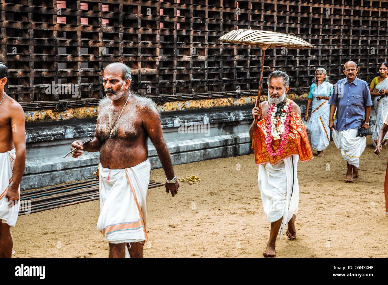 Locals in traditional dress enjoy a religious ceremony in Kerala, India ...