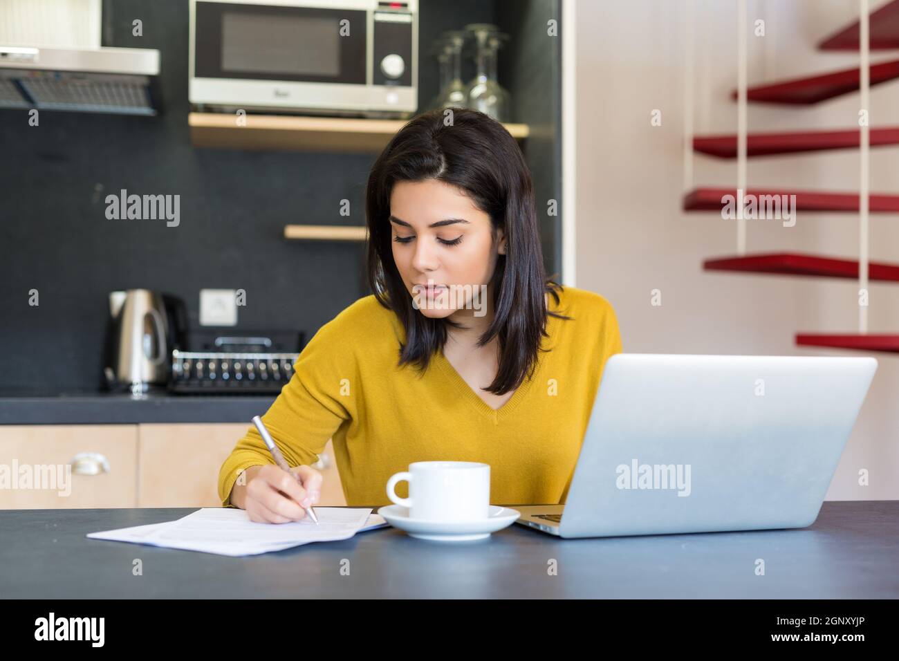 Young woman working at home in the morning Stock Photo - Alamy