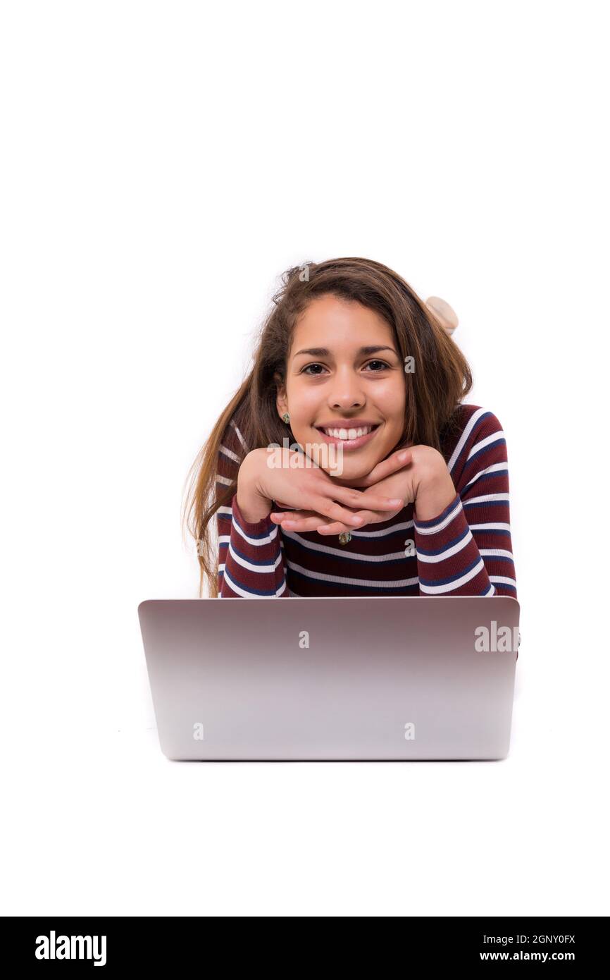 Young student working with her laptop, isolated over a white background ...