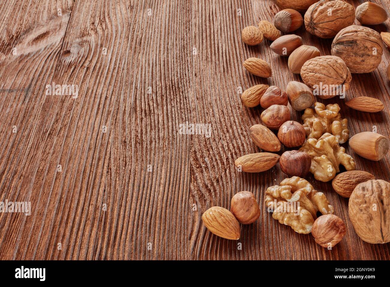 Different kinds nuts. Various varieties of whole nuts and kernels on ...