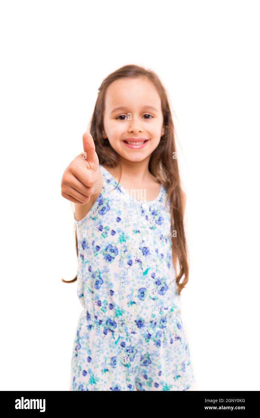Small girl showing thumbs up, isolated over white background Stock ...