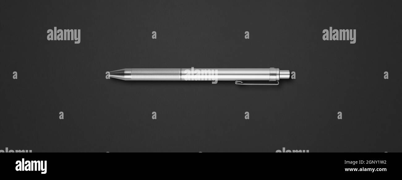 Steel metal pen isolated on black background banner Stock Photo - Alamy