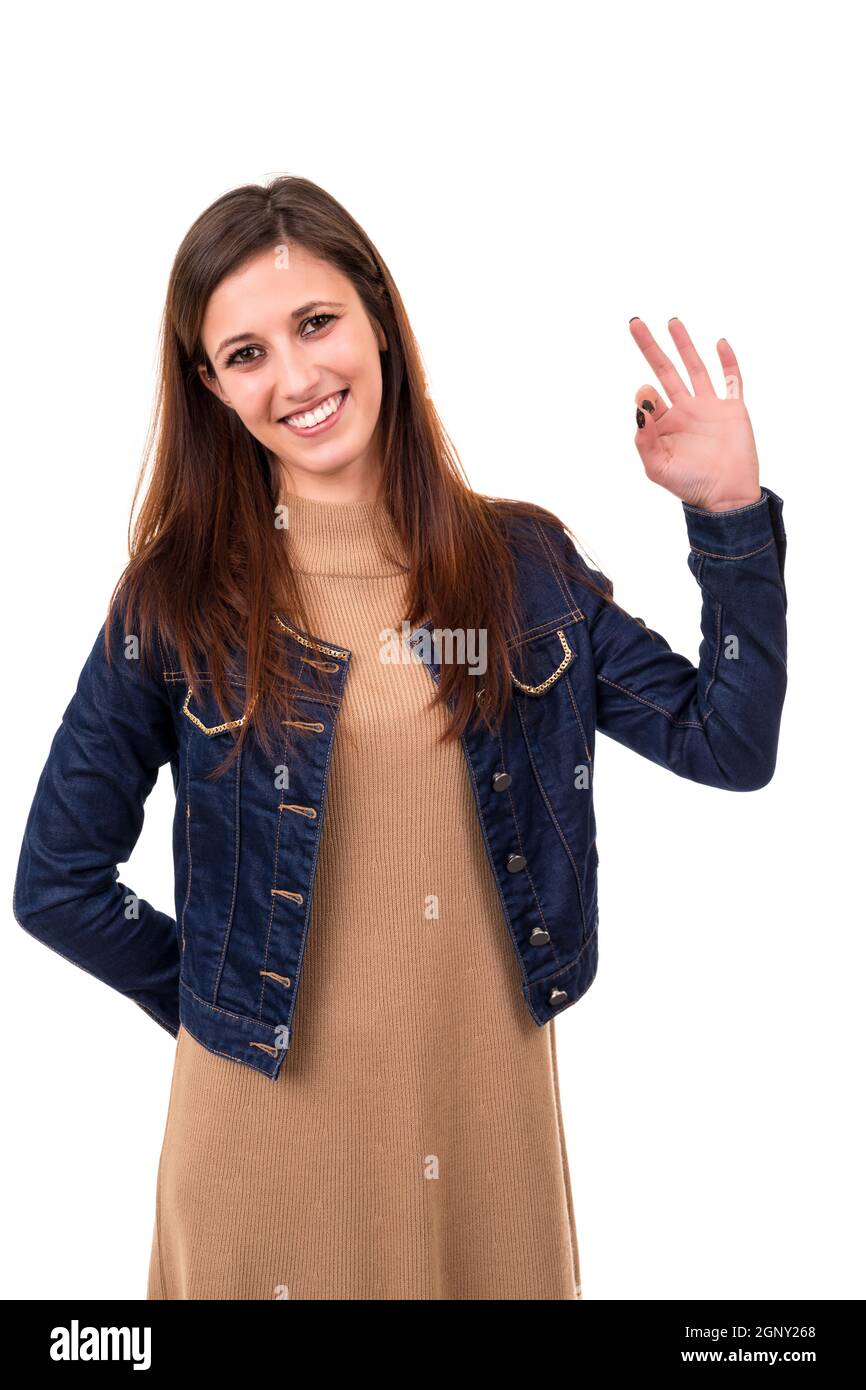 Beautiful young woman signaling ok, isolated over white Stock Photo - Alamy