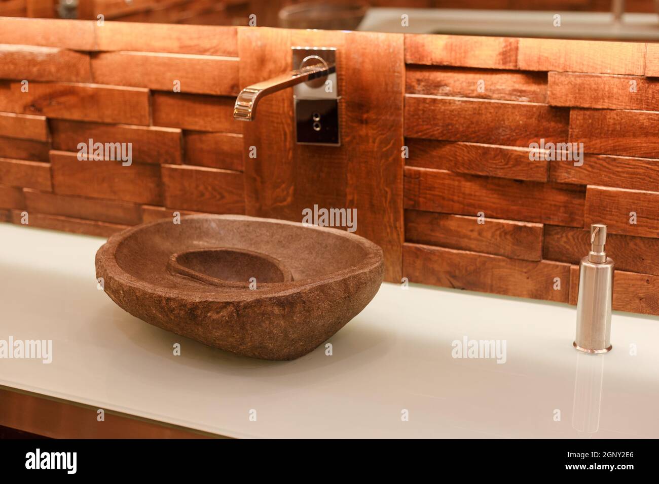 Stylish sink made of light natural stone. Bathroom with stone washbasin ...
