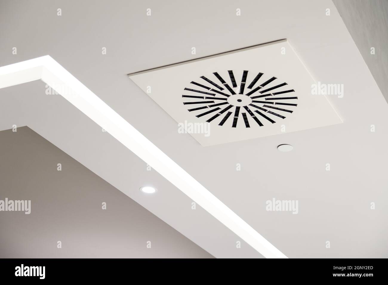 Circular air ventilation grill on the white ceiling Stock Photo - Alamy