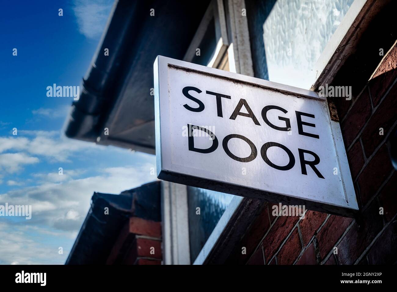 Stage door sign above entrance to theatre Stock Photo - Alamy