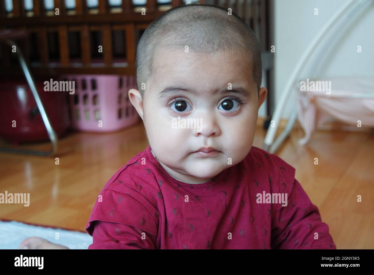 Baby girl with lovely face, big eyes and cute face gesture. Toddler ...
