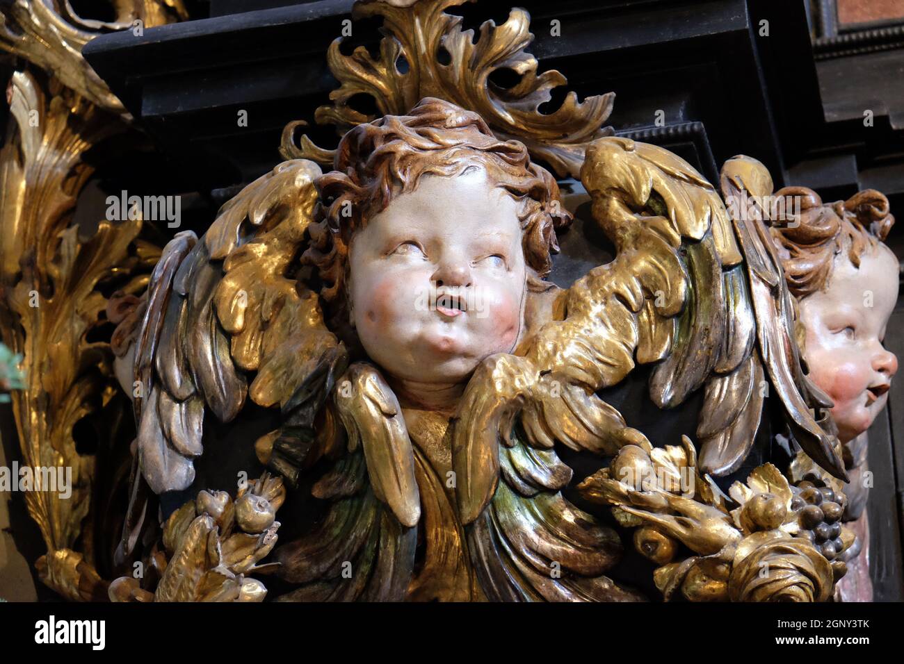 Angel on the altar of the Holy Rosary in Parish church in St. Wolfgang ...