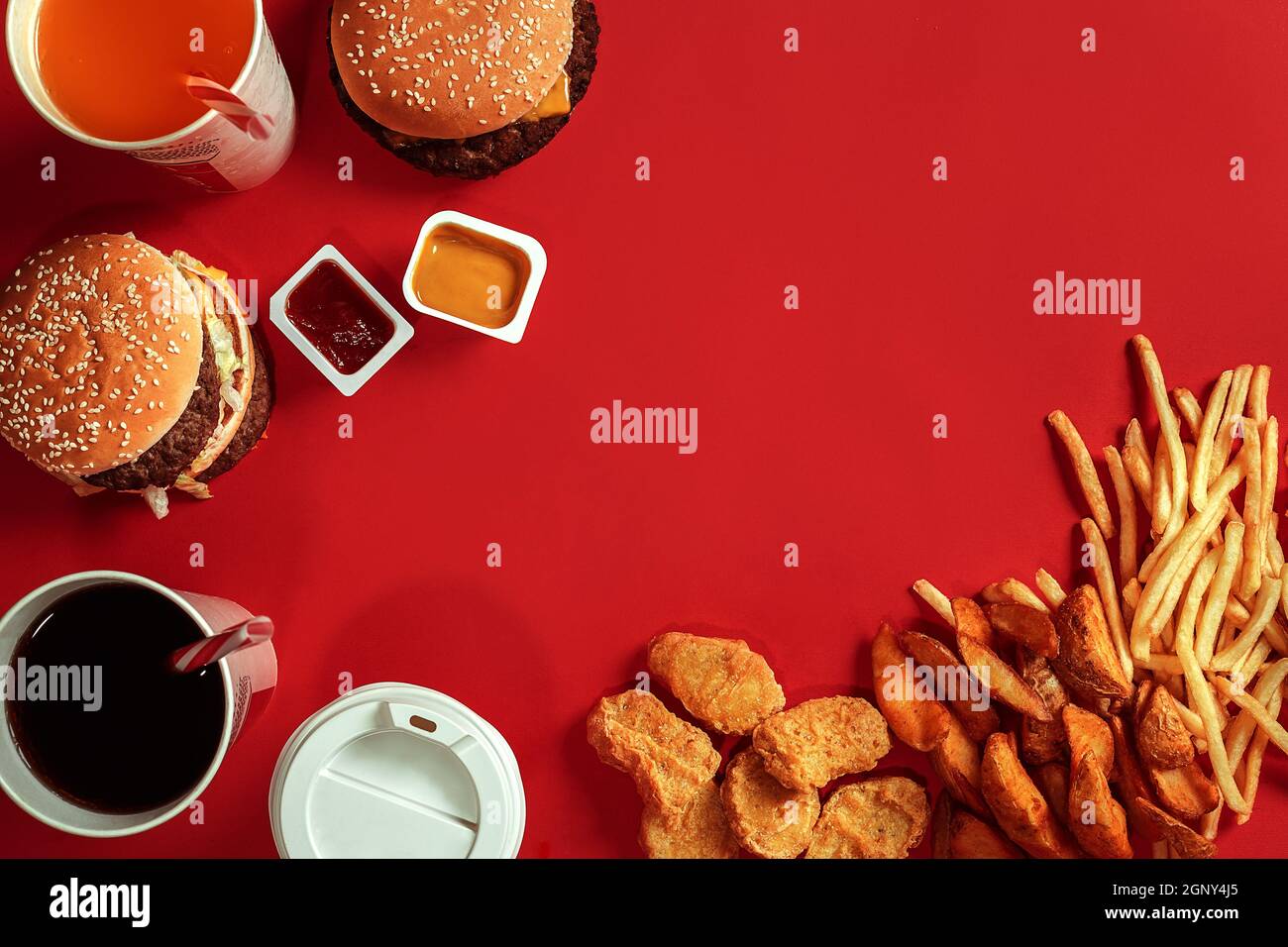 Fast food dish top view. Meat burger, potato chips and glass of drink ...