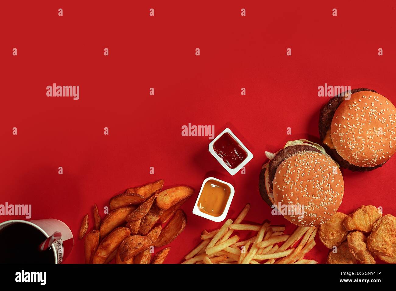 Fast food dish top view. Meat burger, potato chips and glass of drink ...