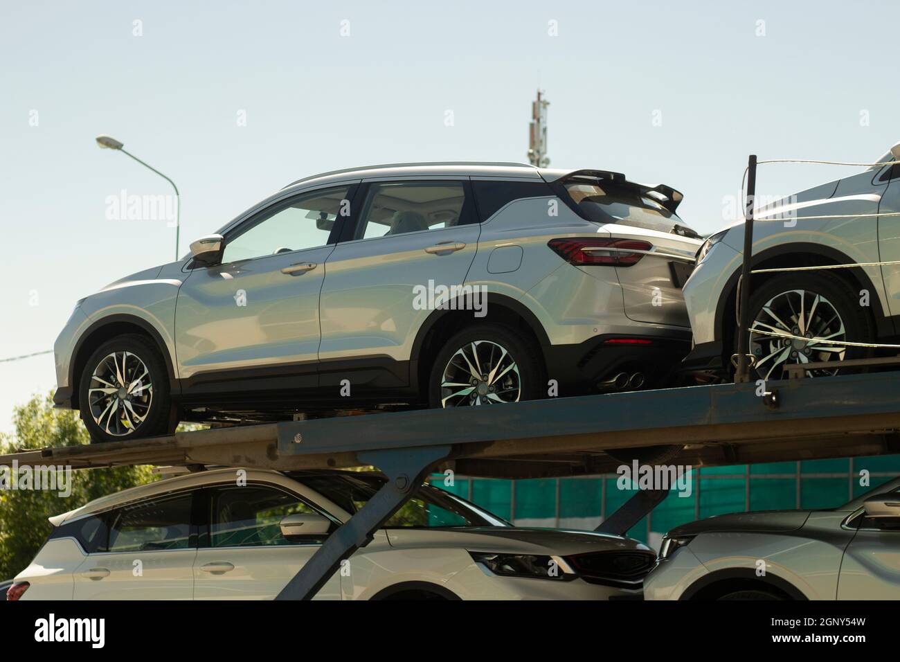 Transportation of new cars by truck. Lots of new machines on the ...