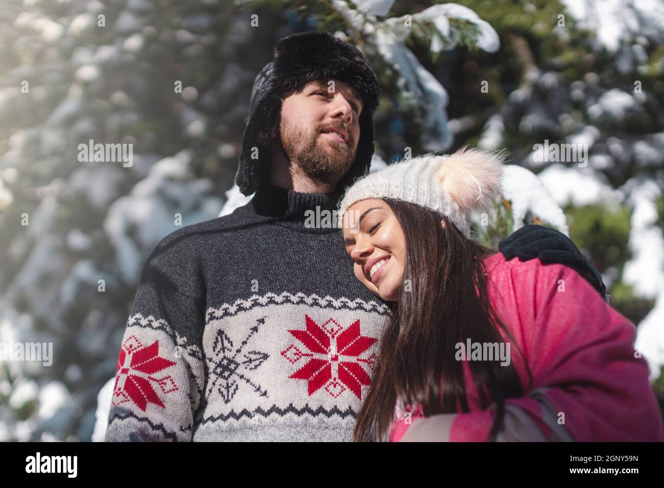 Beautiful romantic woman smiling and lying on the man chest in winter ...