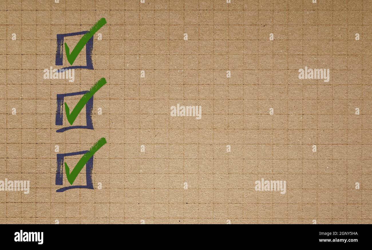 Checklist on checkered recycled paper writing pad concept Stock Photo ...