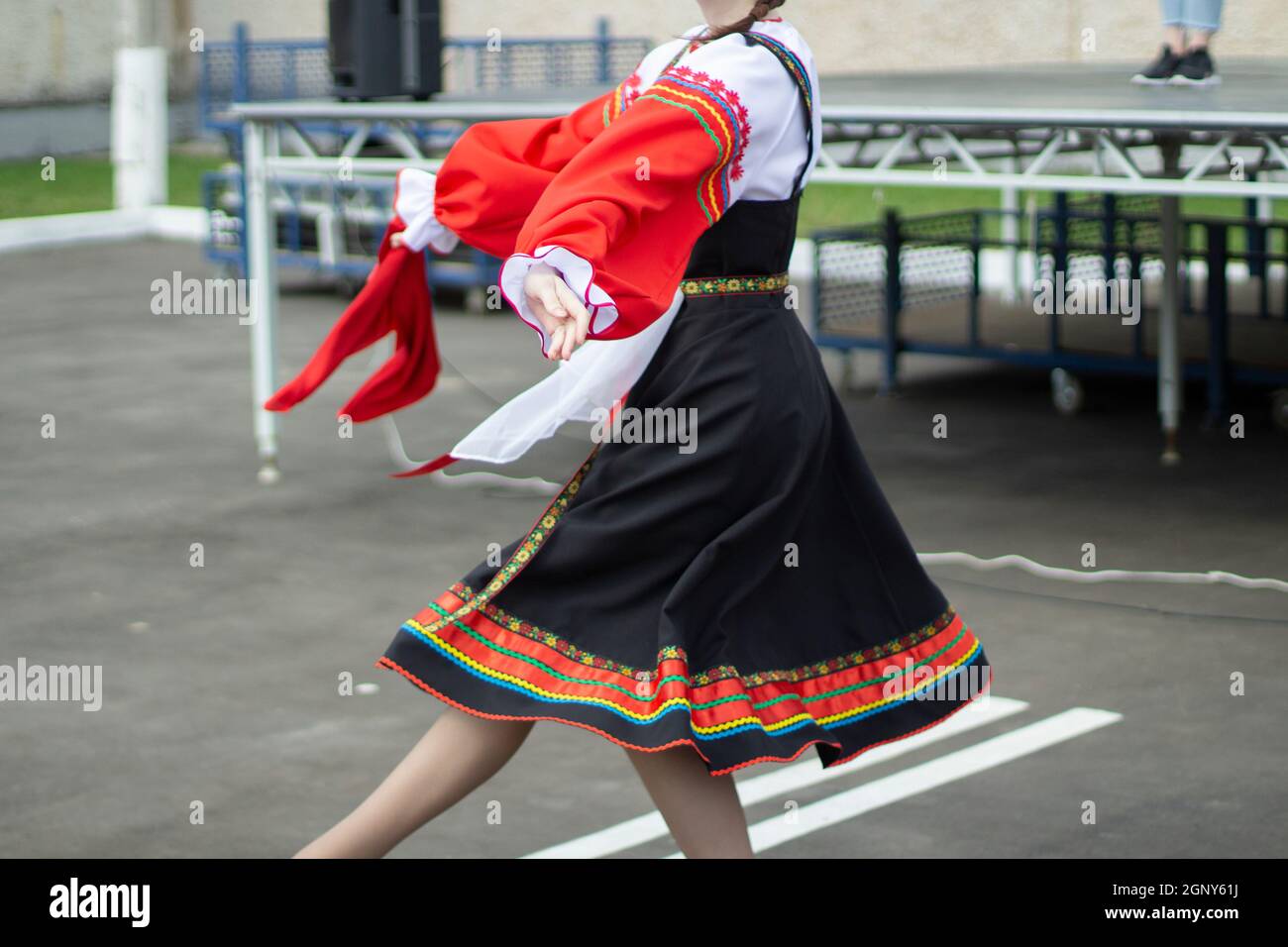 A girl dances Russian folk dance. Performance of a girl with a folk ...