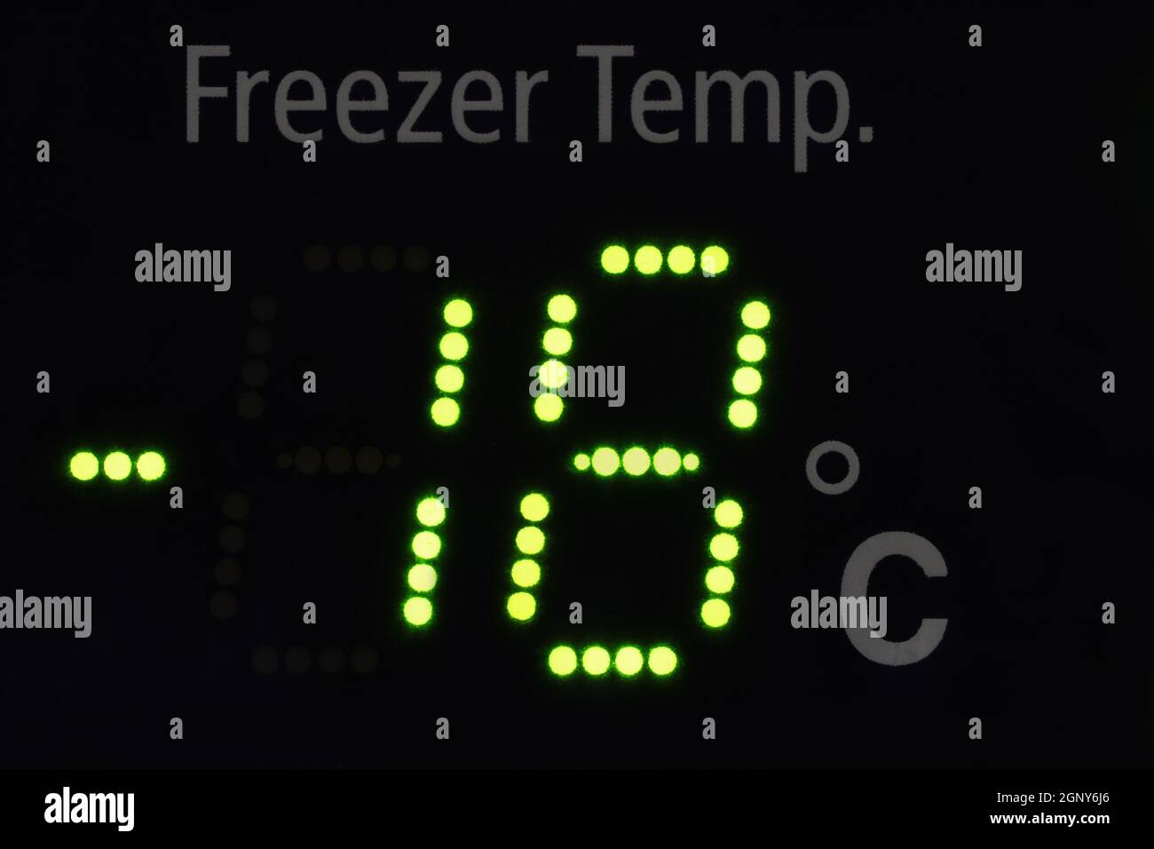 Close up of a freeze indicator showing -18 degrees in green led letters ...