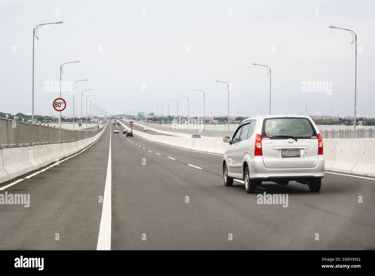 Highway traffic on a bridge between Surabaya and Madura with street ...