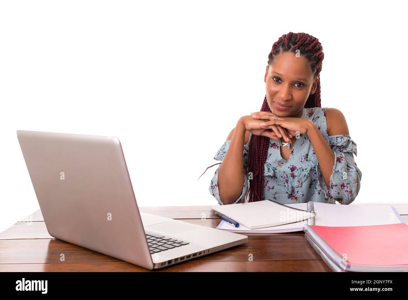 Young african student working with her laptop, isolated over a white ...
