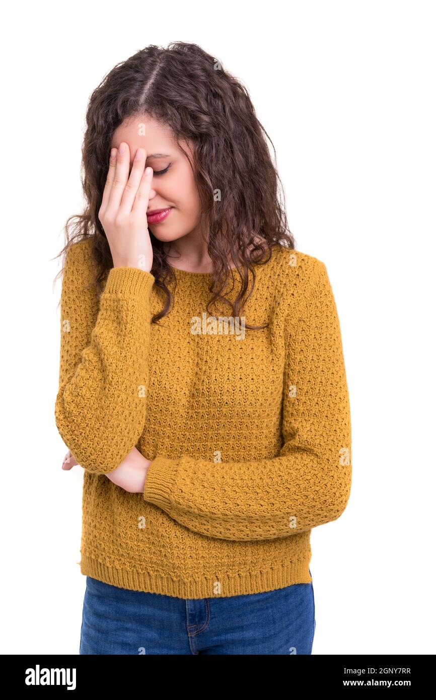 Young woman with a strong headache, isolated over white background ...