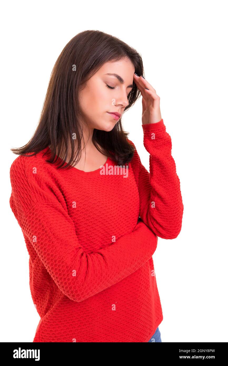 Young woman with a strong headache, isolated over white background ...