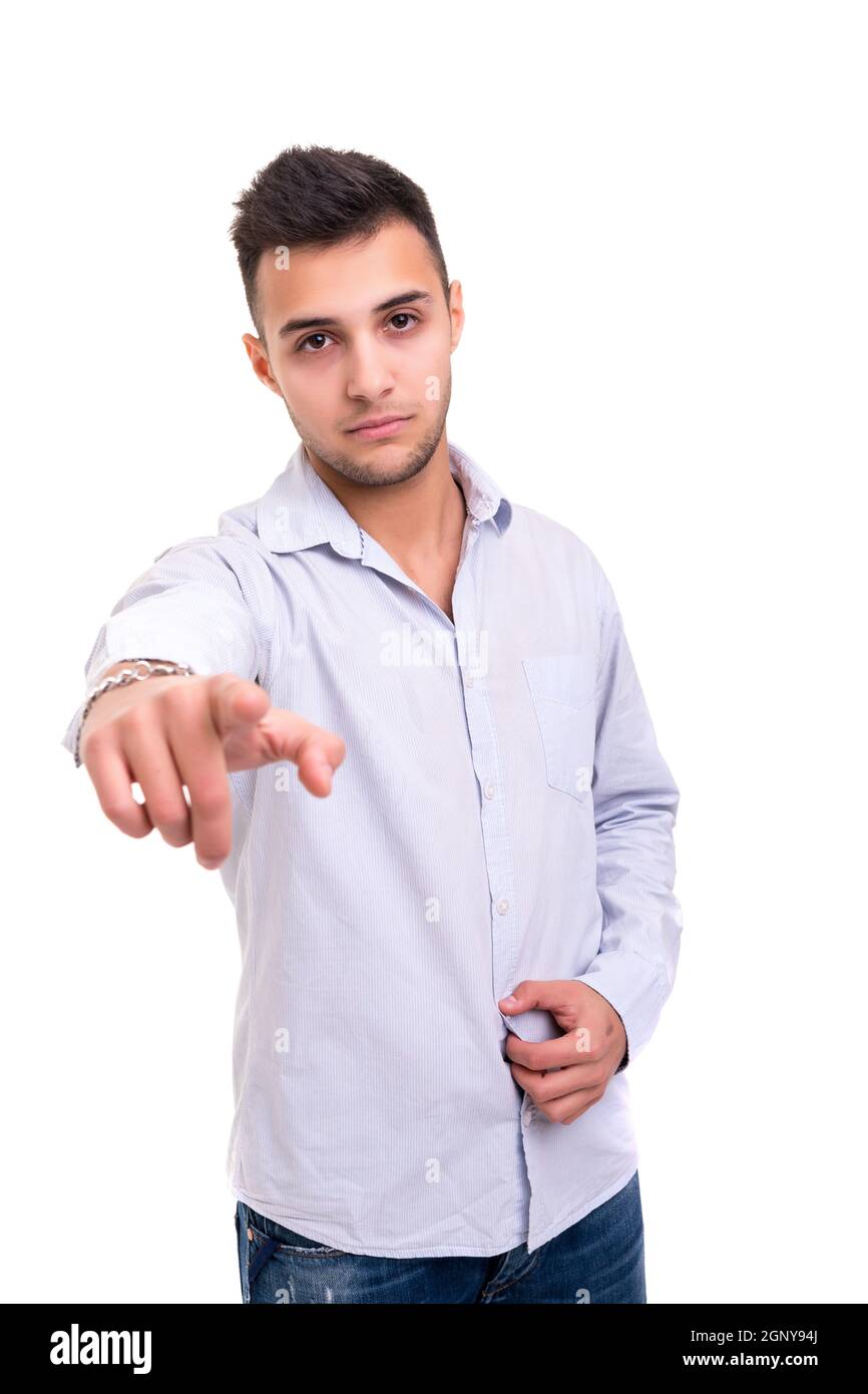 Handsome young man pointing at you, isolated over white background ...