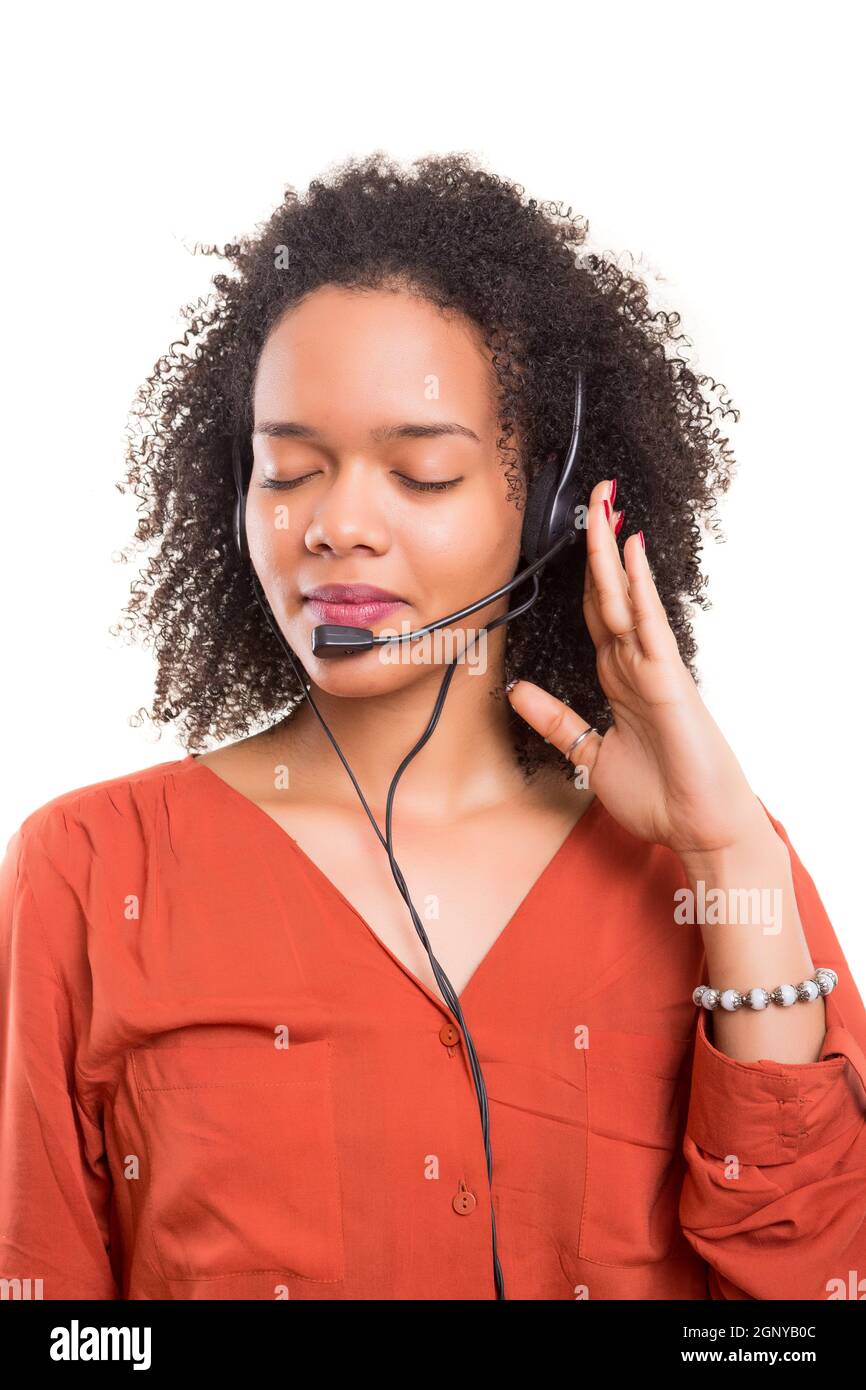 A friendly telephone operator smiling isolated over a white background ...